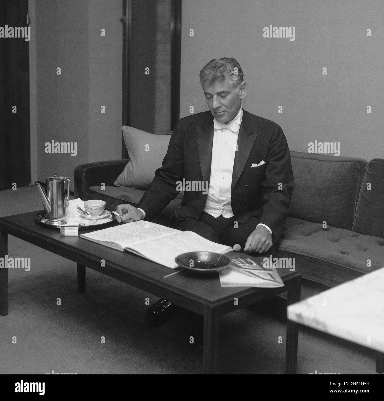 Leonard Bernstein, Musical Director of the New York Philharmonic, rests ...