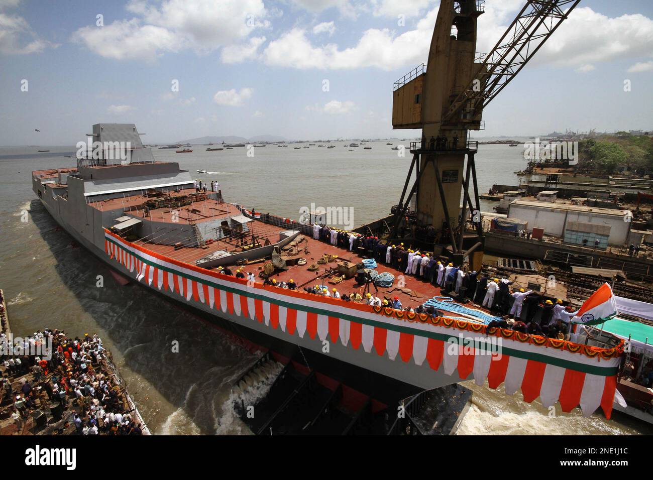 People look on as Indian Navy's war ship INS Chennai is launched in ...