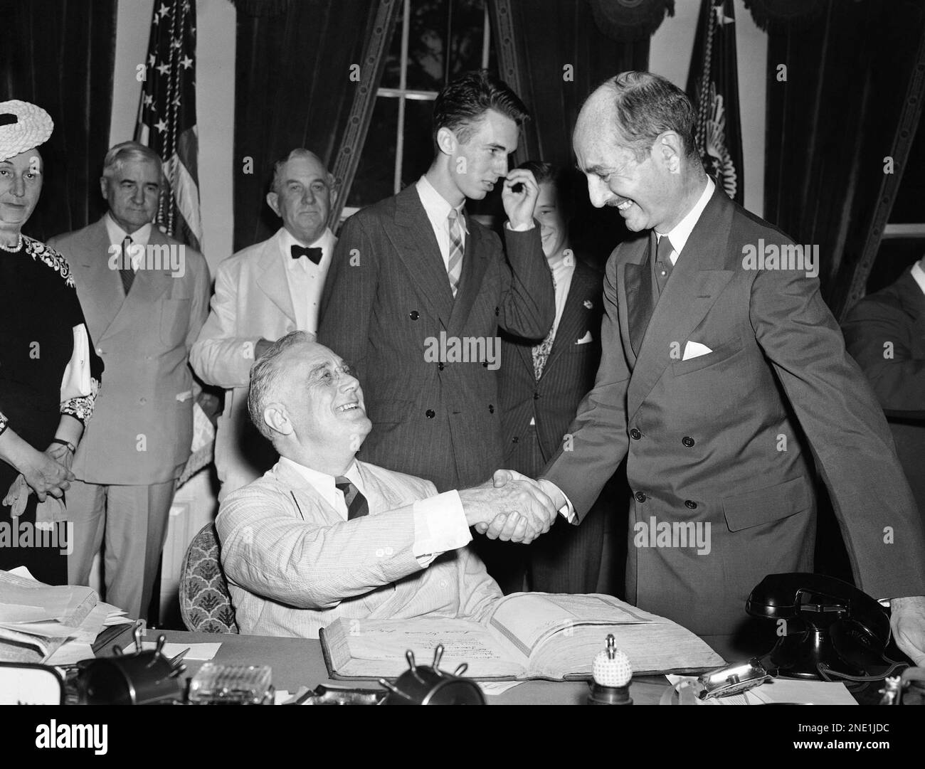 President Franklin D. Roosevelt and Francis Biddle shake hands after ...