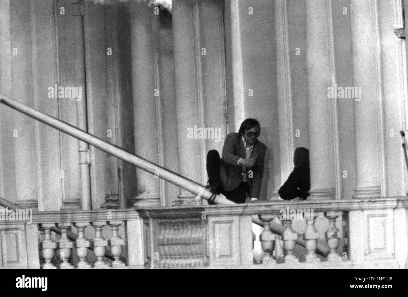 Sim Harris, the BBC sound man, left, leaps to safety from the Iranian ...