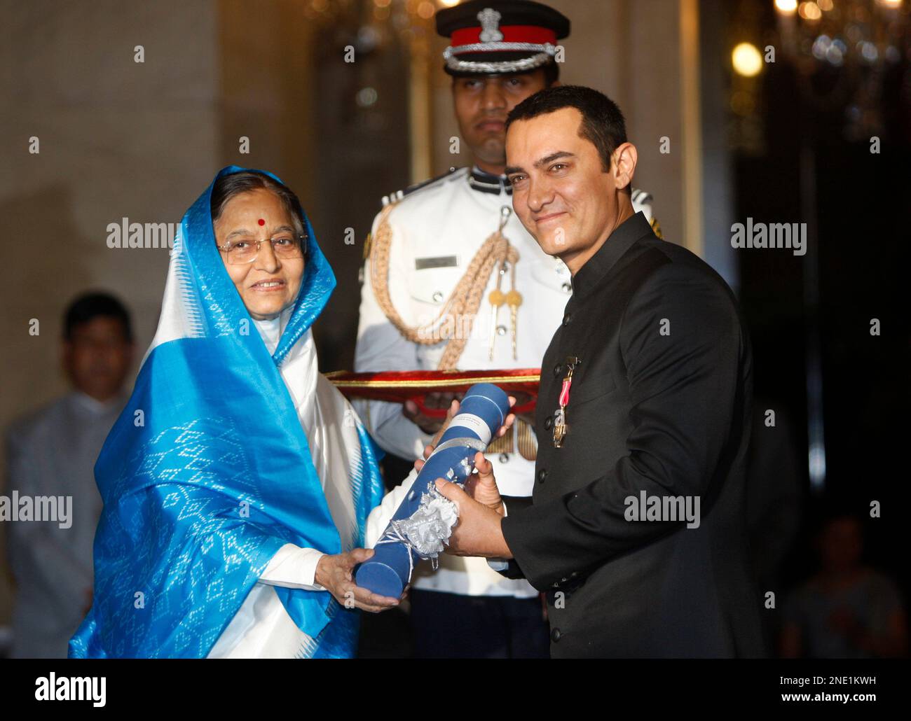 Indian President Pratibha Patil, left, presents the Padma Bhushan, one ...