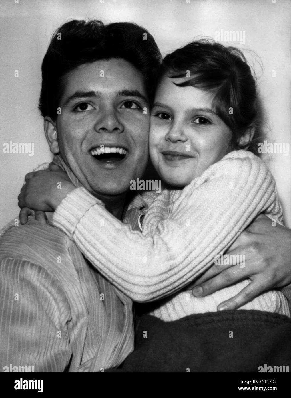 Pop Singer Cliff Richards gets a good luck hug from his little sister ...