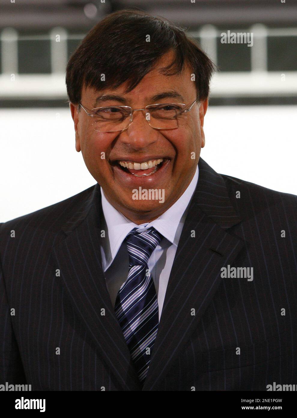 Lakshmi Mittal, Chairman and CEO of ArcelorMittal, laughs during a ...