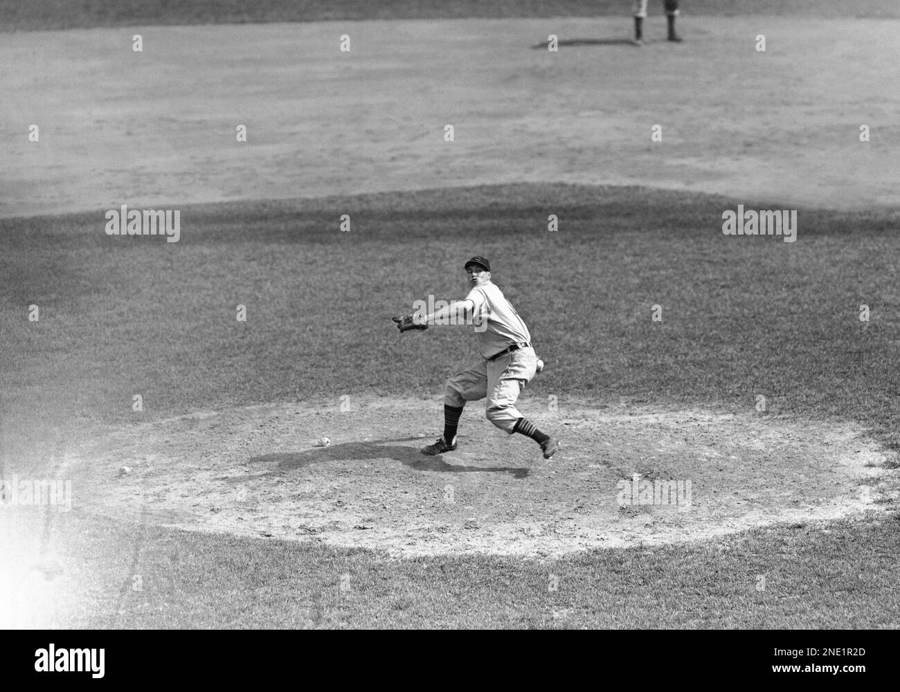 Bob Feller, Cleveland pitcher, sets himself for a delivery in the game ...