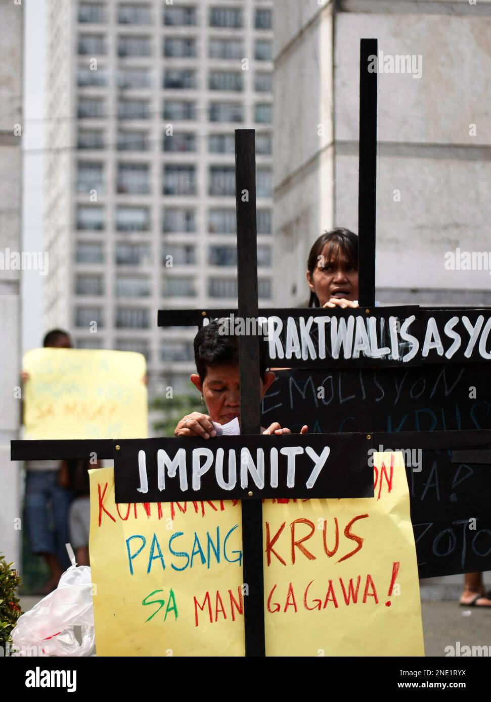 Protesters display crosses to reenact the passion or suffering of Jesus ...