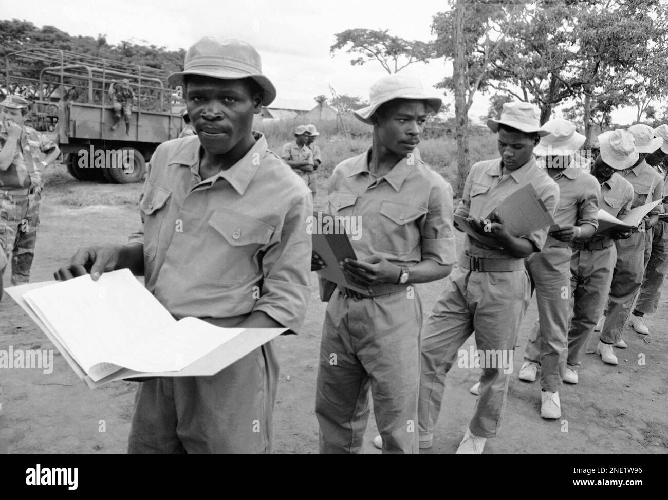 Guerrilla recruits for the new integrated Rhodesian army sign up while ...