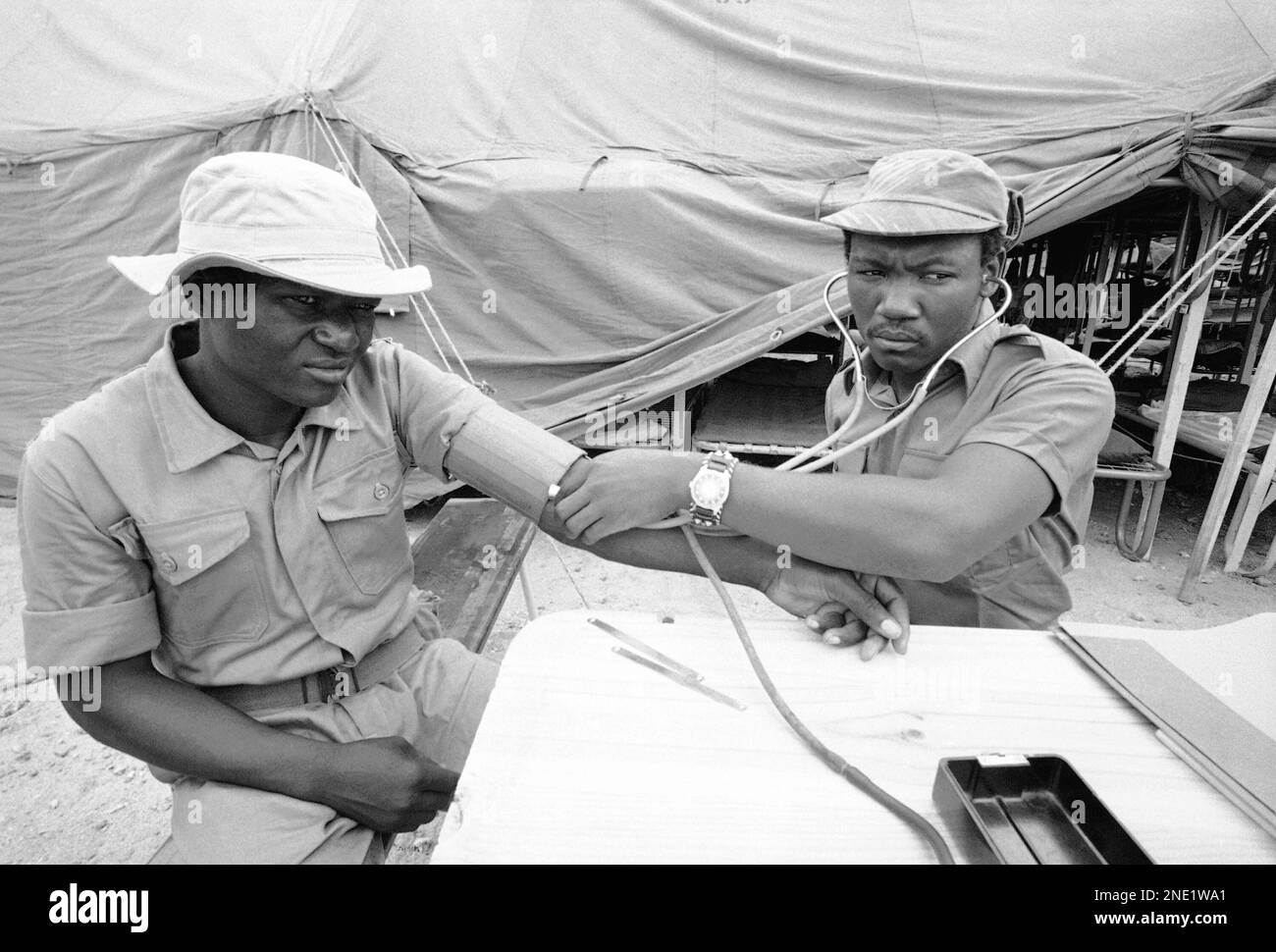Guerrilla recruit joining the Rhodesian army takes a physical in Mtoko ...