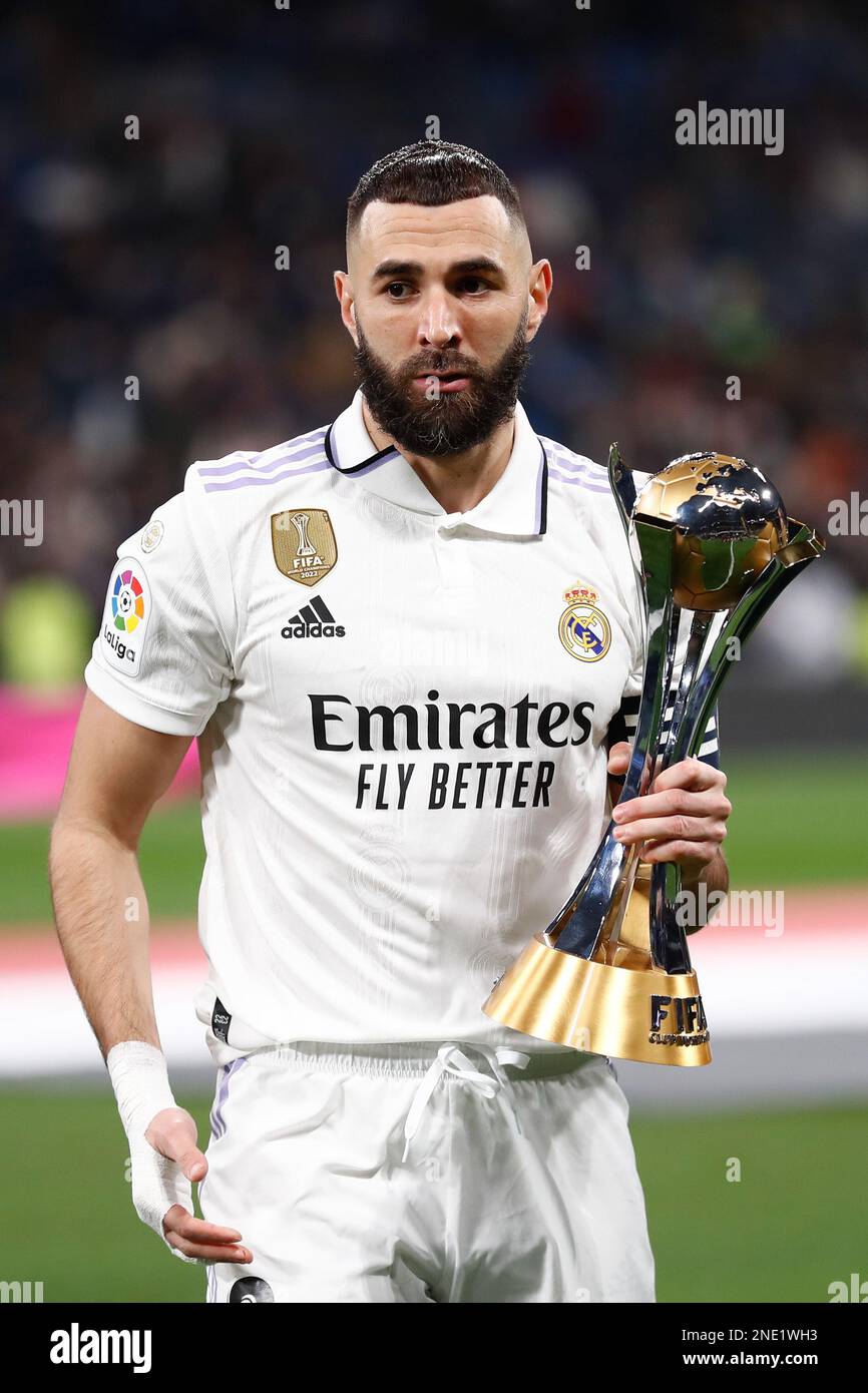 Karim Benzema of Real Madrid shows the Club World Cup trophy to the ...