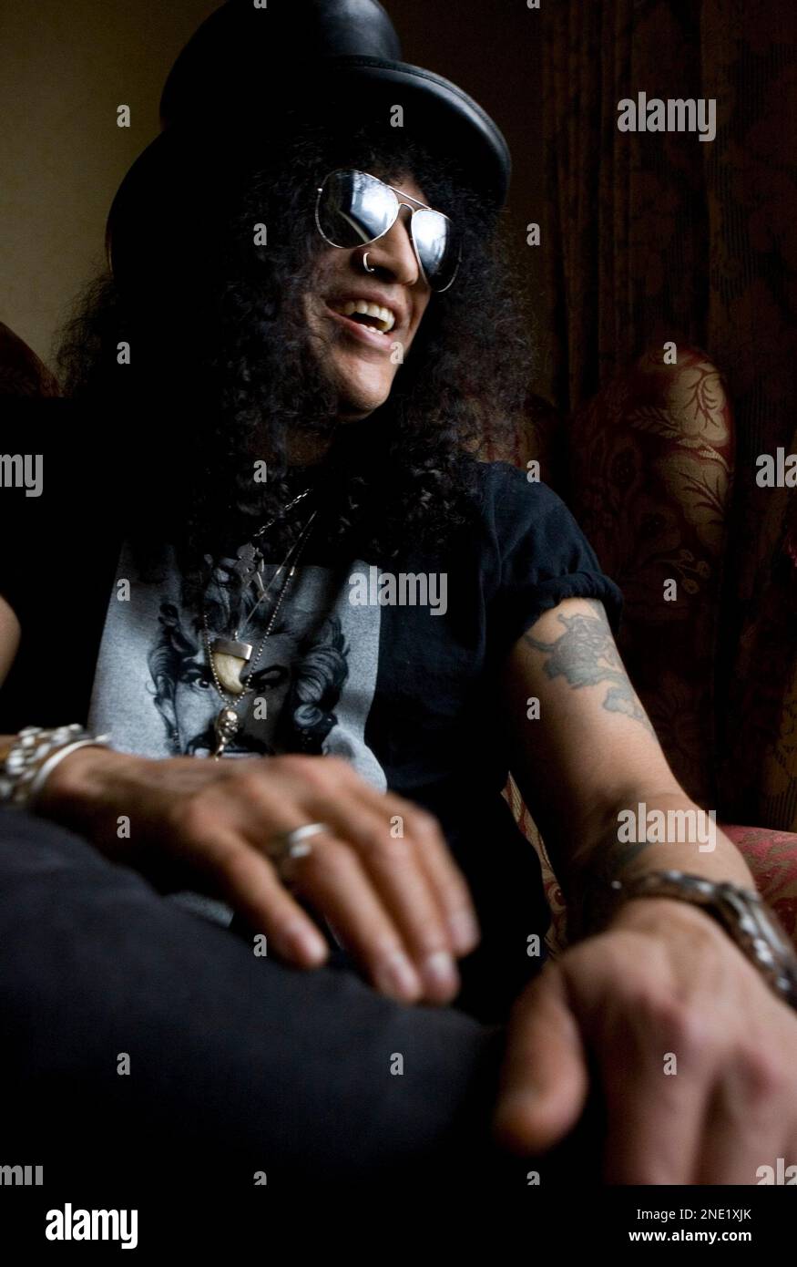 In this March 12, 2010 photo, guitarist Slash poses for a photo in ...