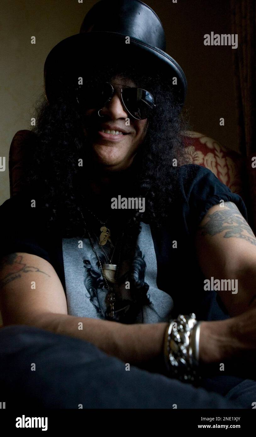 In this March 12, 2010 photo, guitarist Slash poses for a photo in ...