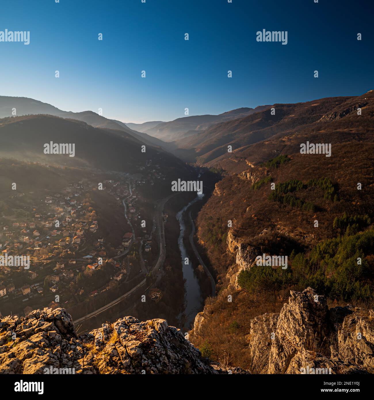 A scenic view of a sprawling valley featuring a winding river, with ...
