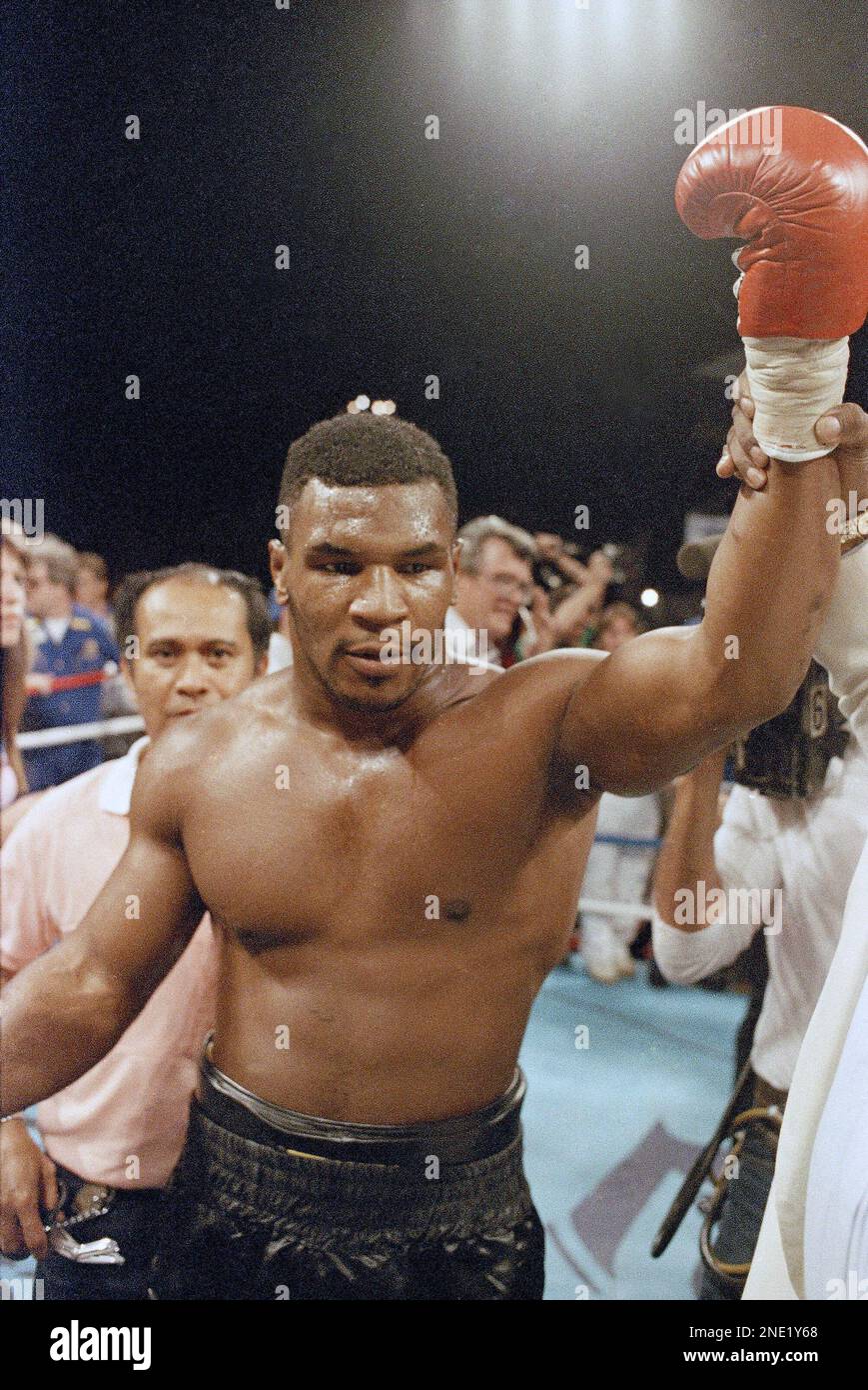 WBC heavyweight champion Mike Tyson raises his fist in the air after ...