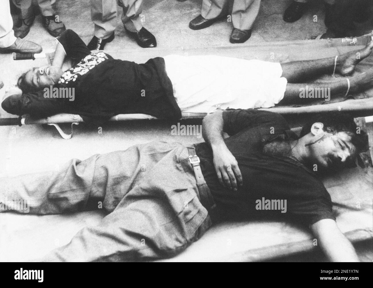 The bodies of Sivarasan and his female accomplice Subha lie in front of ...