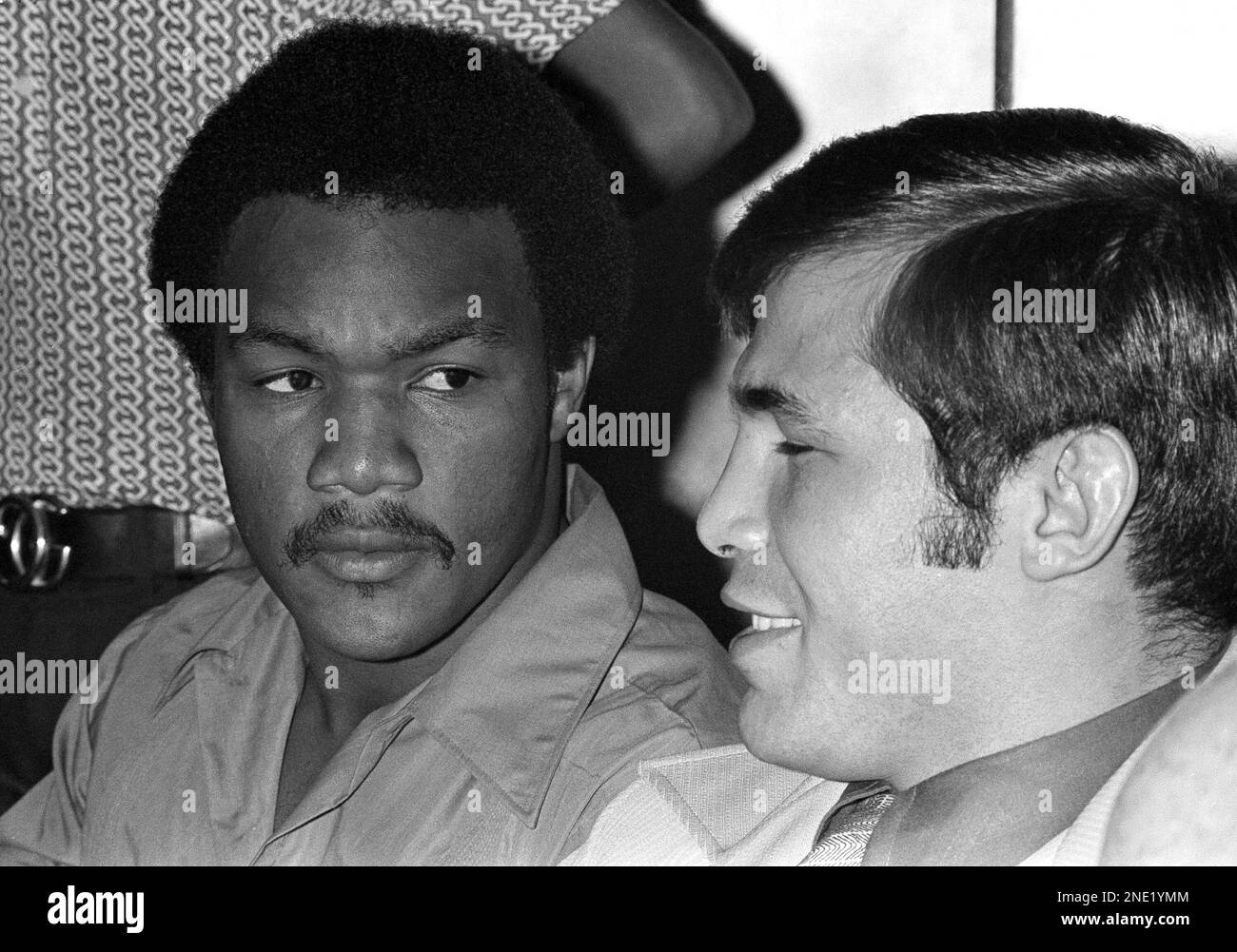 World Heavyweight Champion George Foreman, left, and his challenger Joe ...