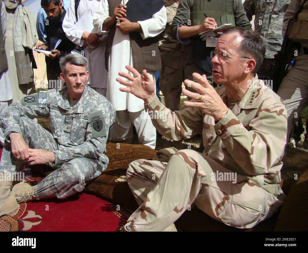 U.S. Joint Chiefs of Staff Navy Adm. Mike Mullen, right, speaks with ...