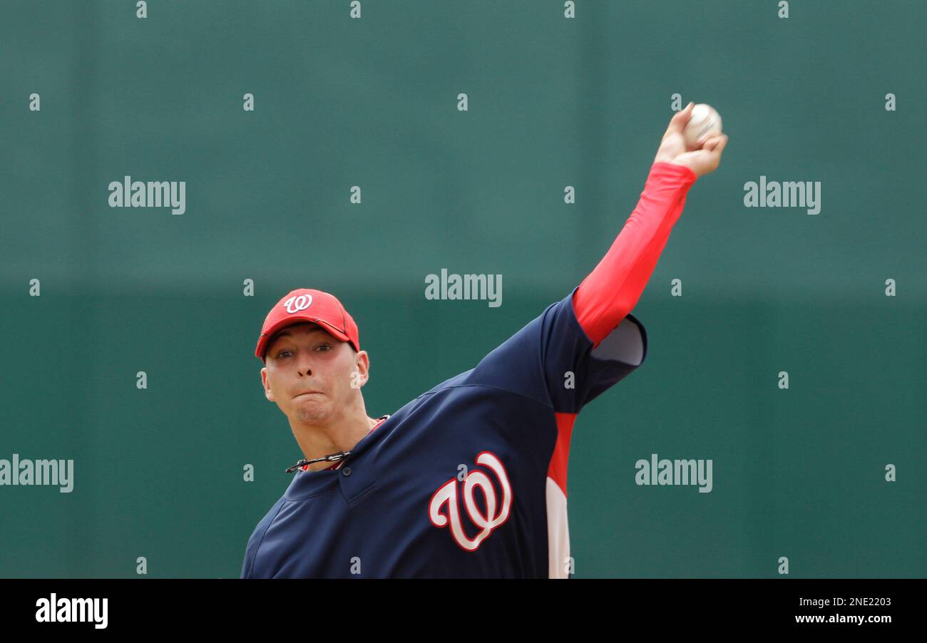 Washington Nationals starter Scott Olsen throws during a spring ...