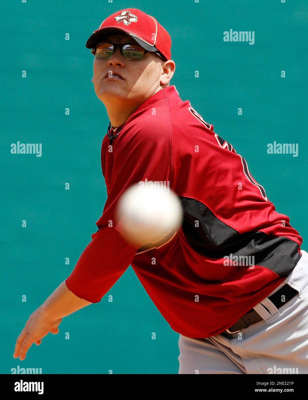 Houston Astros pitcher Gustavo Chacin warms up in the first inning of a ...