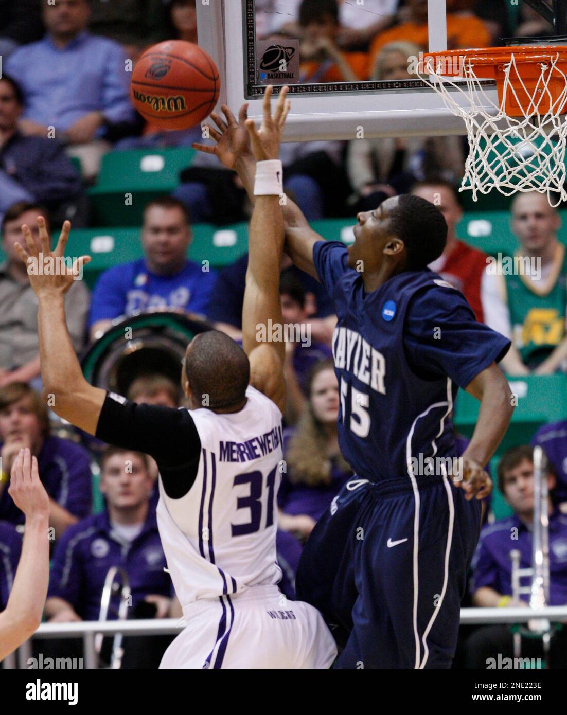 Xavier's Jordan Crawford tries to block a shot by Kansas State's Chris ...