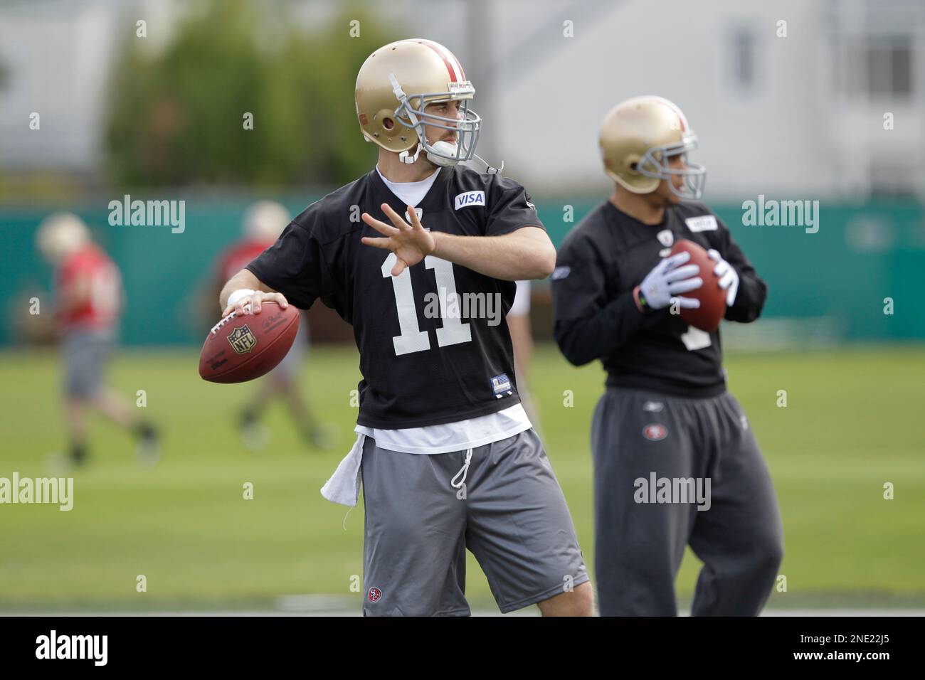 San Francisco 49ers quarterback Alex Smith throws next to quarterback ...
