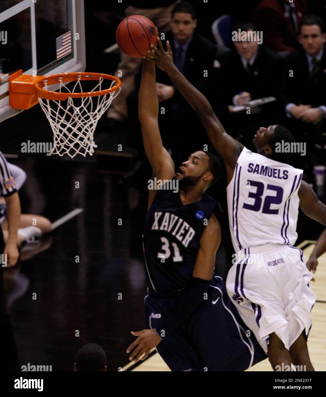 Xavier's Jason Love (31) shoots around the defense of Kansas State's ...