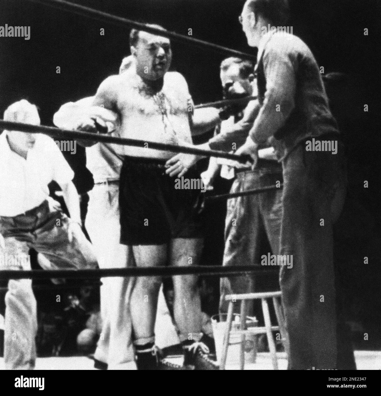 Tony Galento has blood streaming from a gash on his face and goes to ...