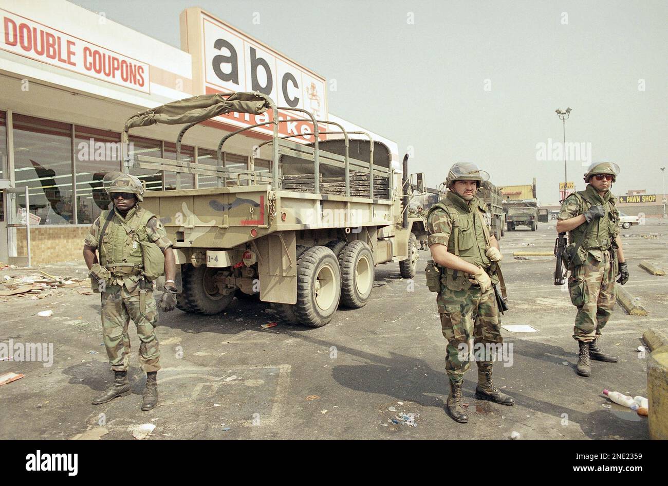 National Guardsmen stand guard outside the ABC Market at Martin Luther ...