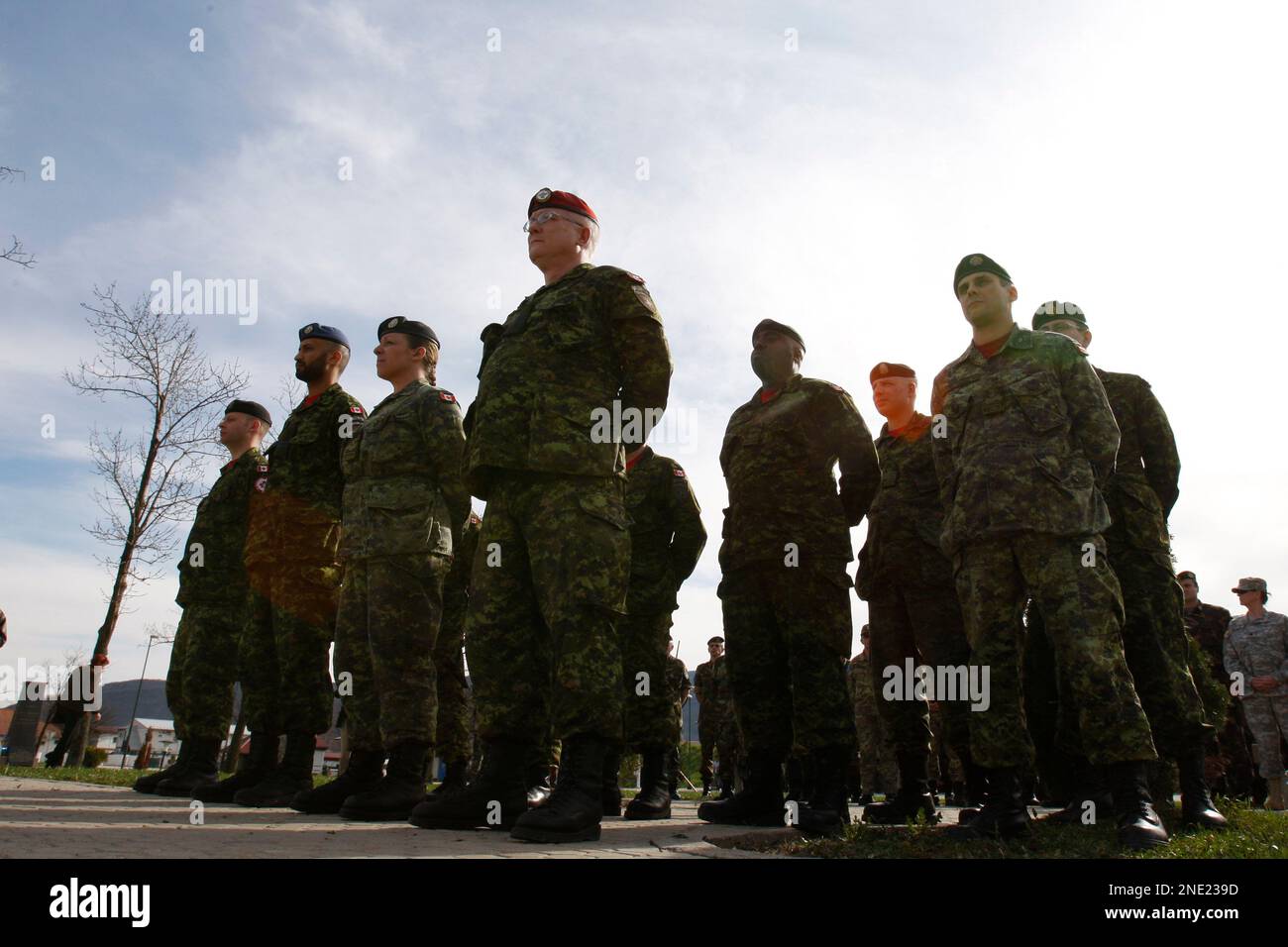 Canadian soldiers stand in an honor guard during a remembrance ceremony ...