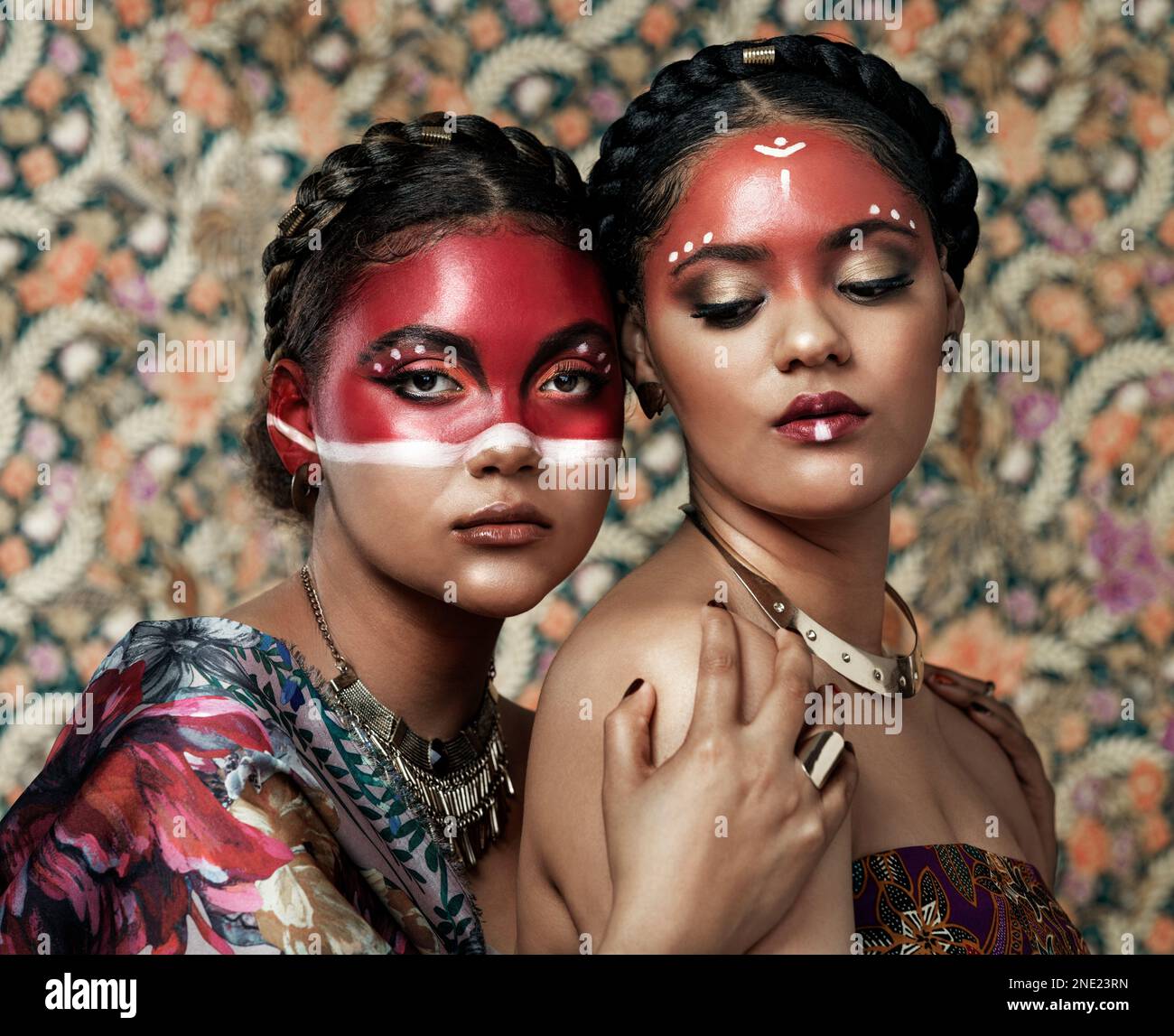 Culture is a beautiful thing to embrace. Portrait of two attractive young women dressed in ...