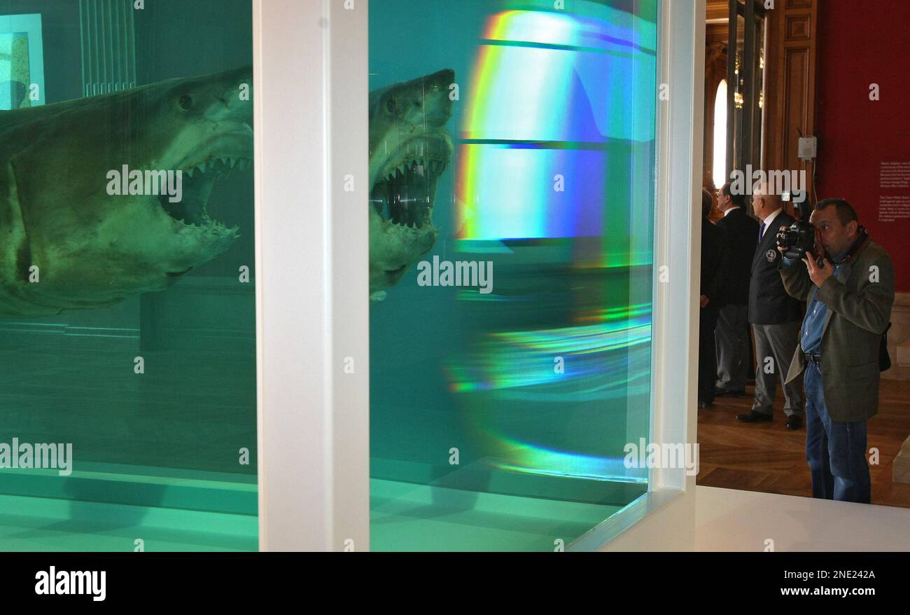 A photographer takes picture of a work of art of British artist Damien ...