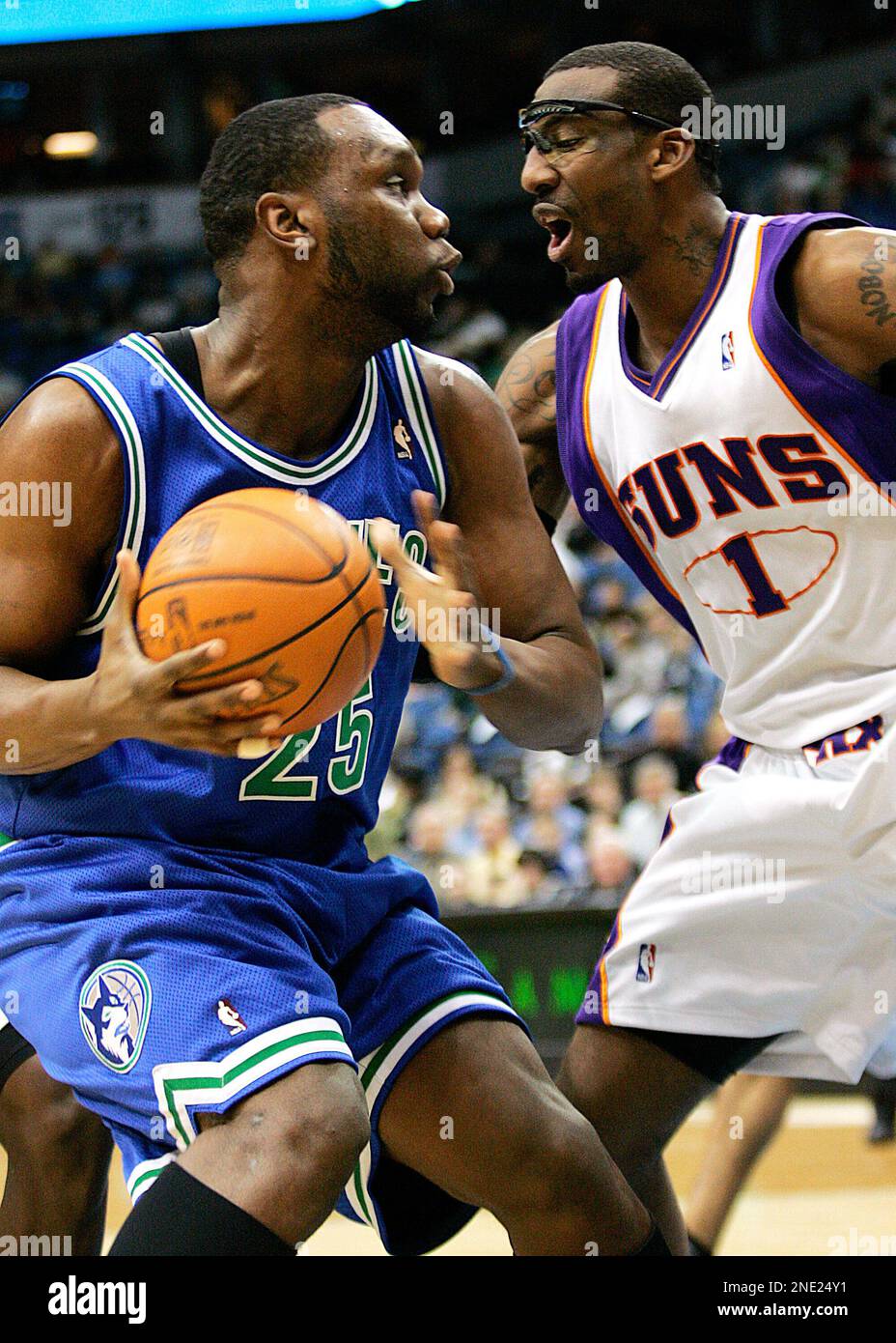 Minnesota Timberwolves forward Al Jefferson, left, drives on Phoenix ...