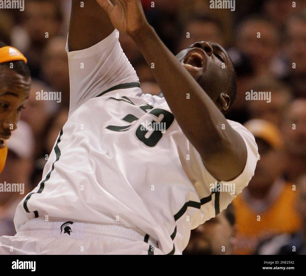 Michigan State's Draymond Green reacts to being knocked down by ...