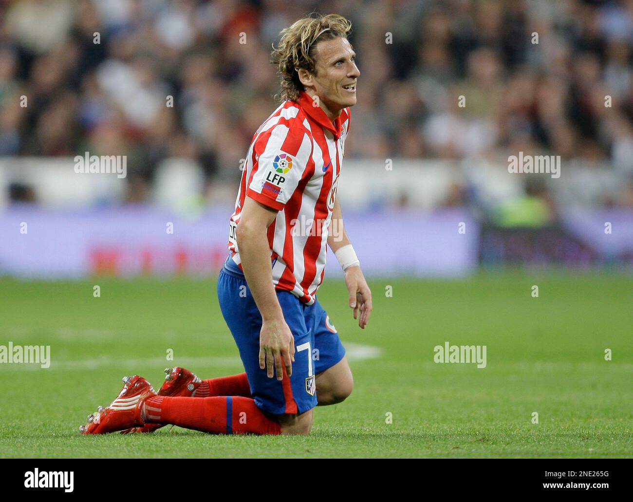 Atletico de Madrid's Diego Forlan from Uruguay reacts during a Spanish ...