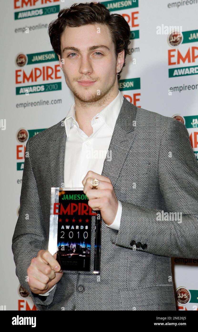 British actor Aaron Johnson poses with the award for Best Newcomer at ...