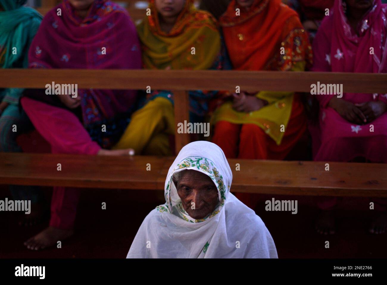 An elderly Pakistani Christian woman prays during a mass on Orthodox ...