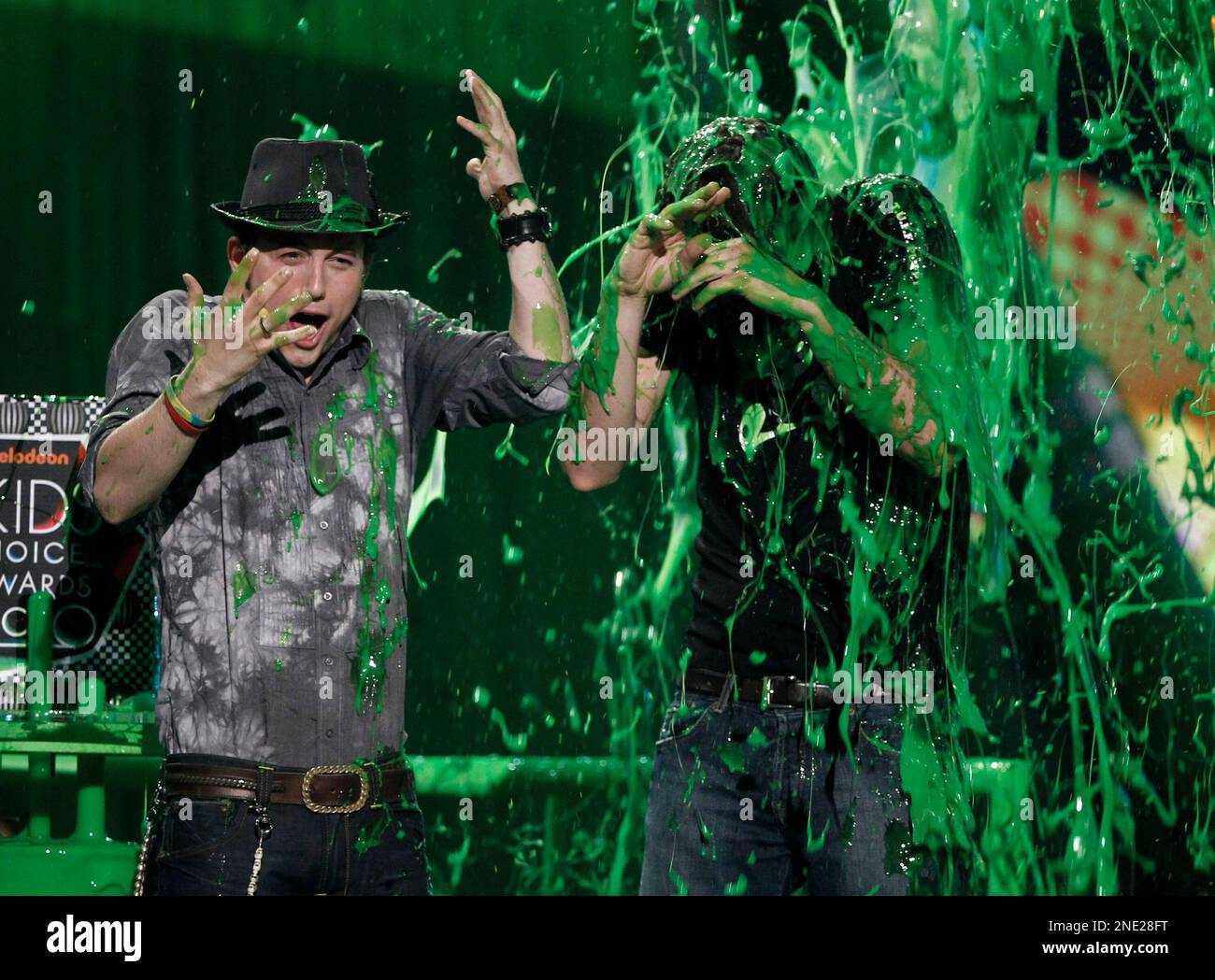 Jackson Rathbone, left, and Jerry Trainor get slimed at Nickelodeon's ...