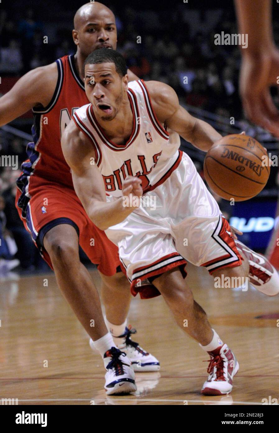 Chicago Bulls' Jannero Pargo right, dribbles past New Jersey Nets ...