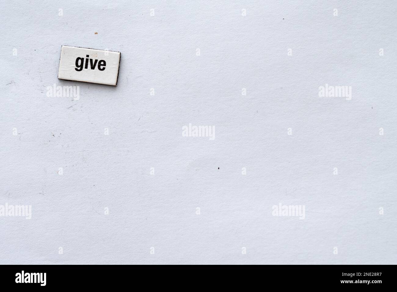 The word give written on white background Stock Photo - Alamy