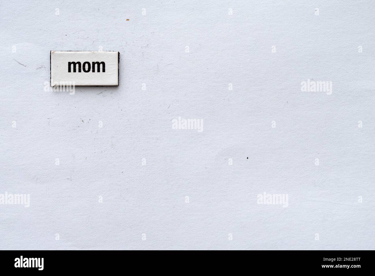 The word mom written on white background Stock Photo - Alamy