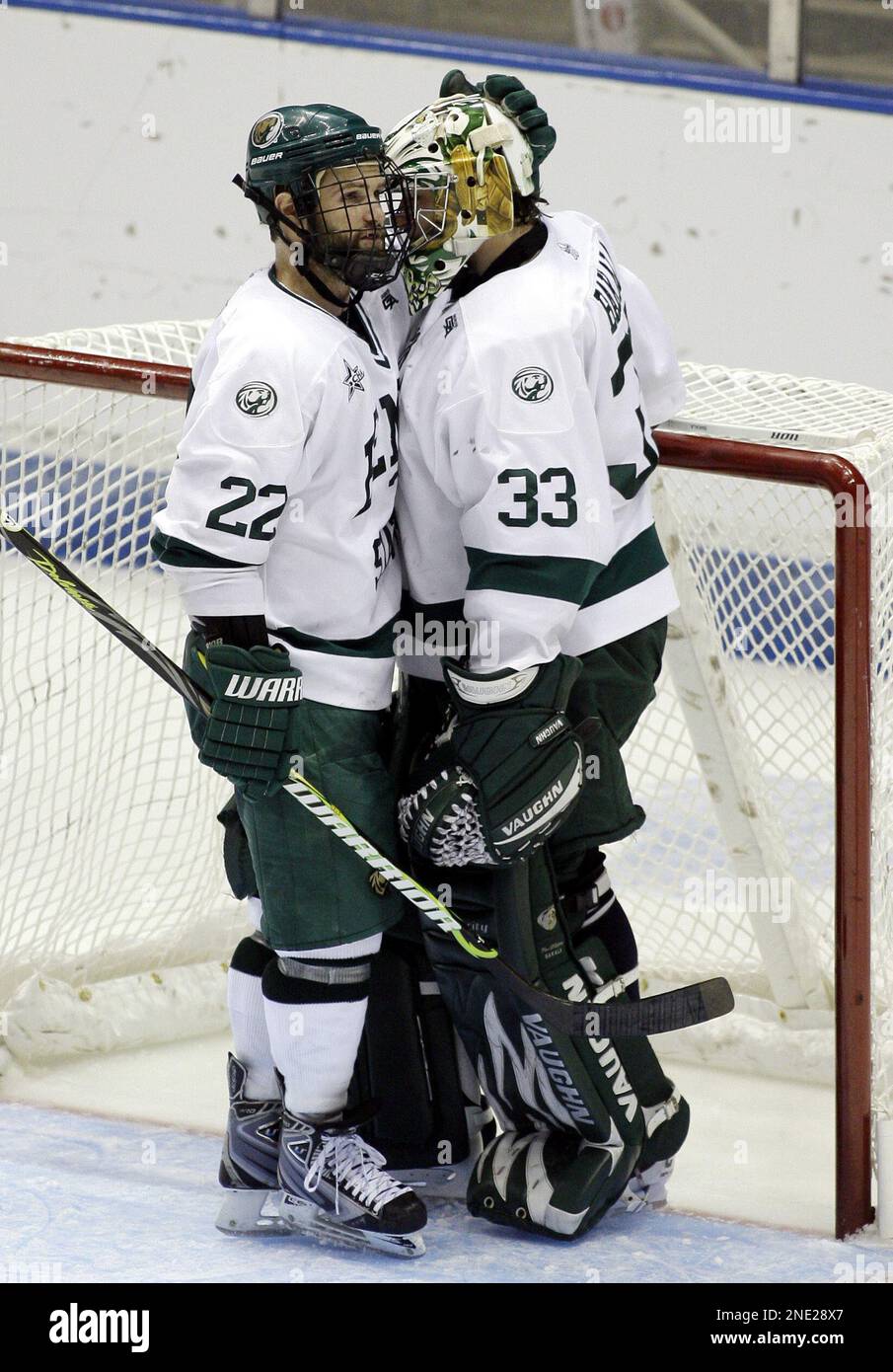 Bemidji State goalie Dan Bakala (33) embraces teammate Ian Lowe (22 ...