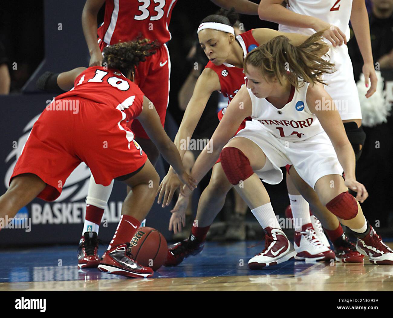 Georgia's Jasmine James, left, and Meredith Mitchell, center, battle ...