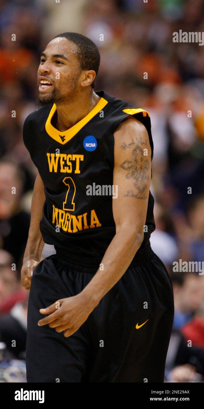 West Virginia's Da'Sean Butler (1) reacts after hitting a three-point ...