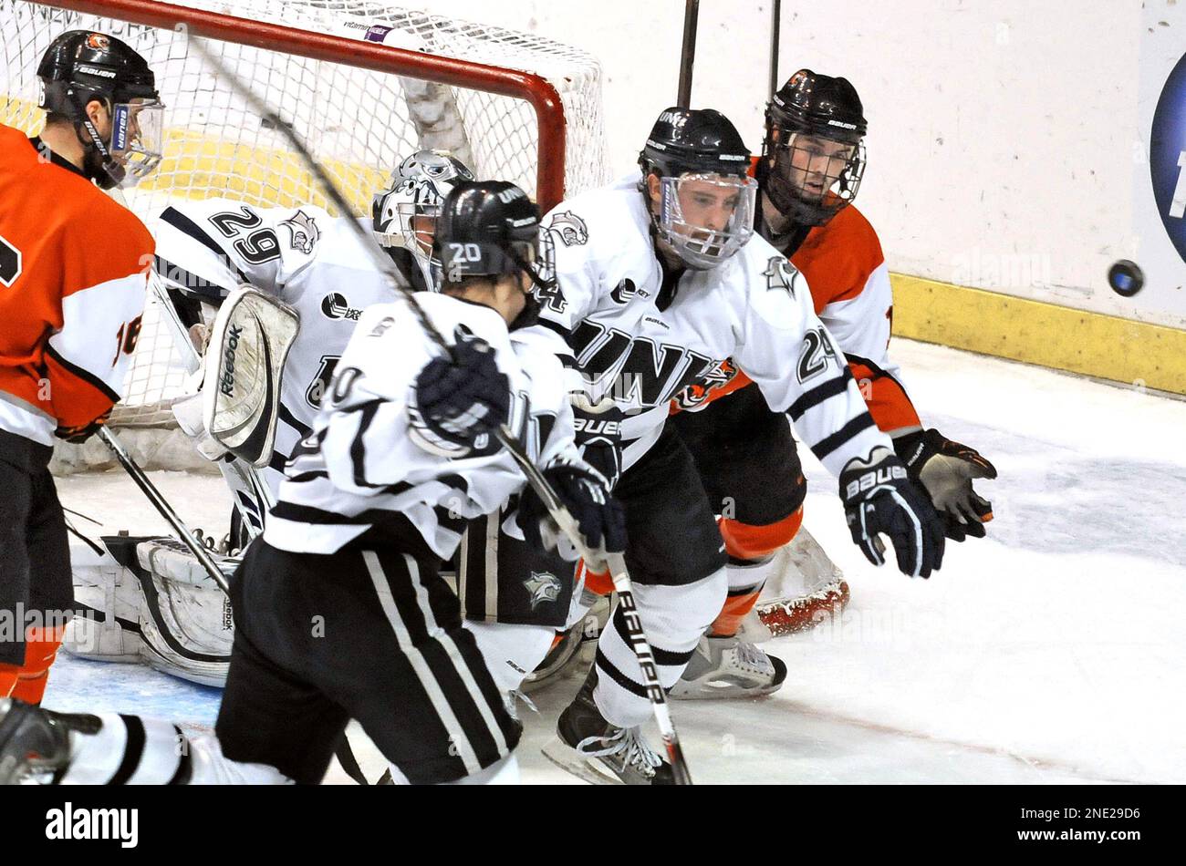 New Hampshire's Matt Campanale (24) watches a loose puck with RIT ...