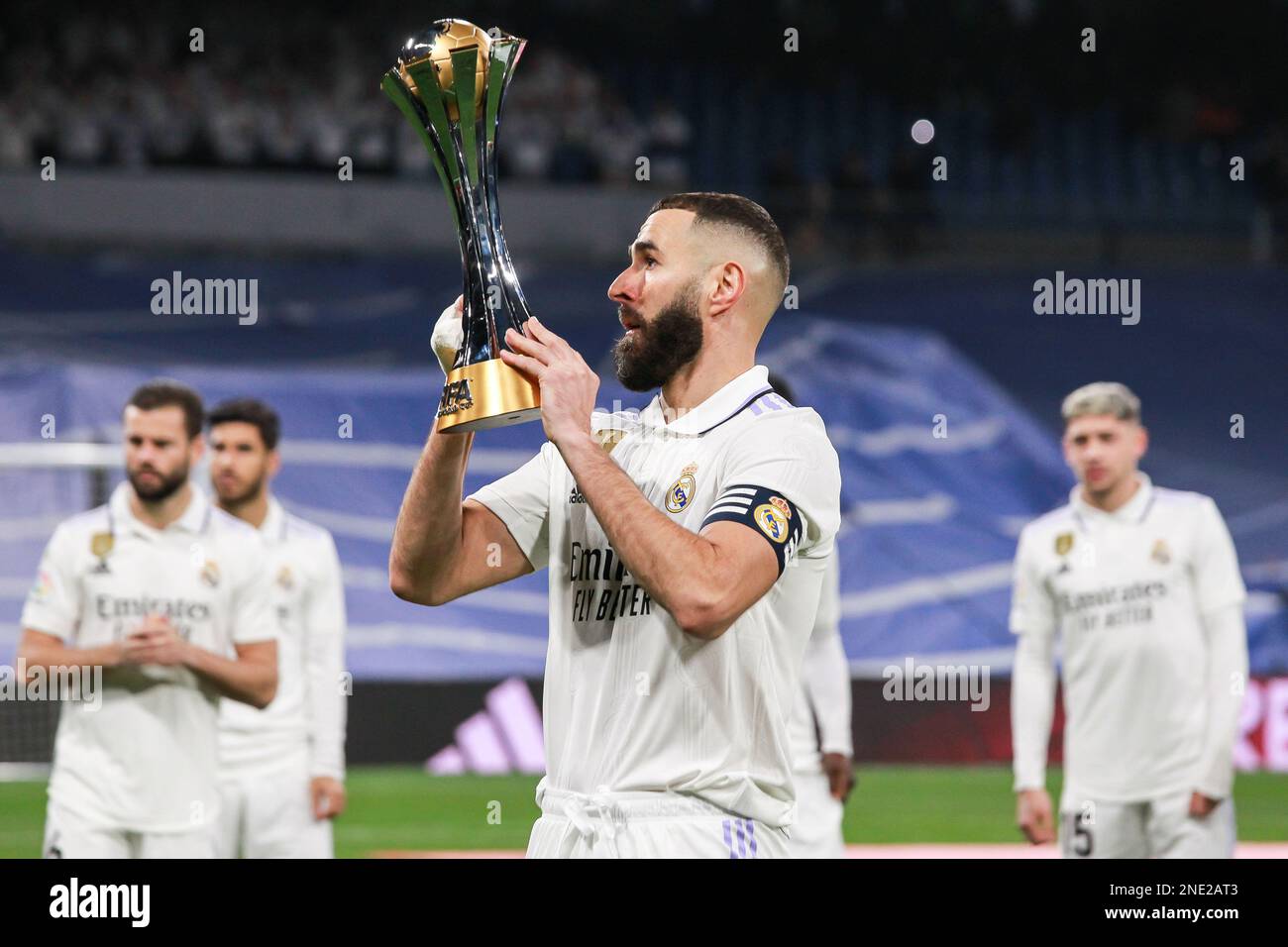 Karim Benzema of Real Madrid shows the Club World Cup trophy to the ...