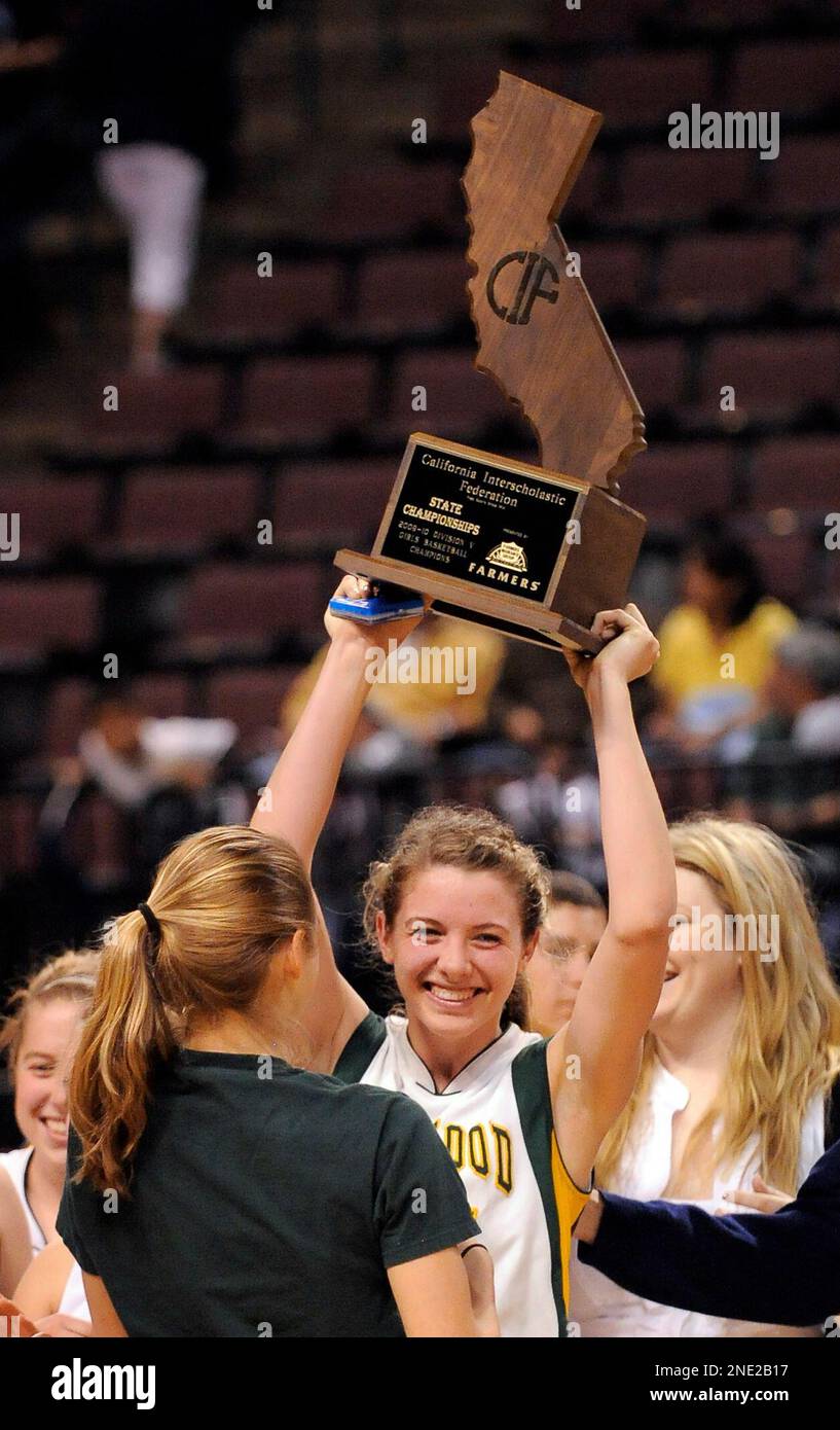 Jenna McLaughlin from Pinewood in Los Altos Hills holds up their trophy ...