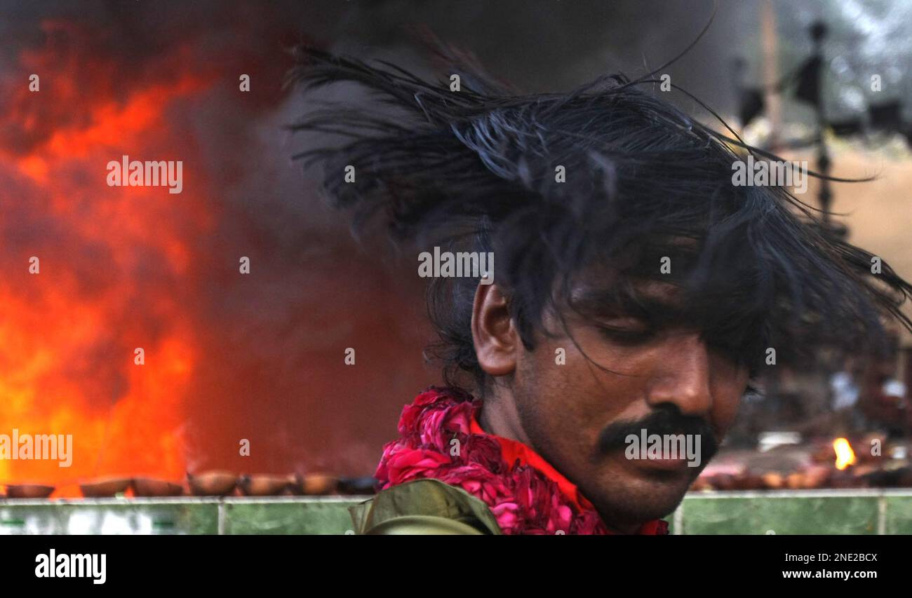 A Pakistani pilgrim of the Sufi poet Shah Hussain dances at his shrine ...