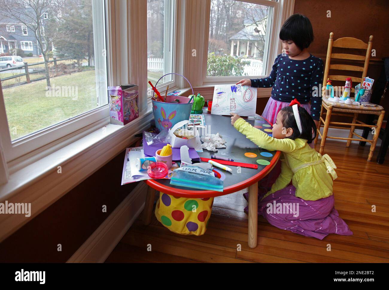 In this photo made March 13, 2010, Olivia Durkin, 7, right, and her ...