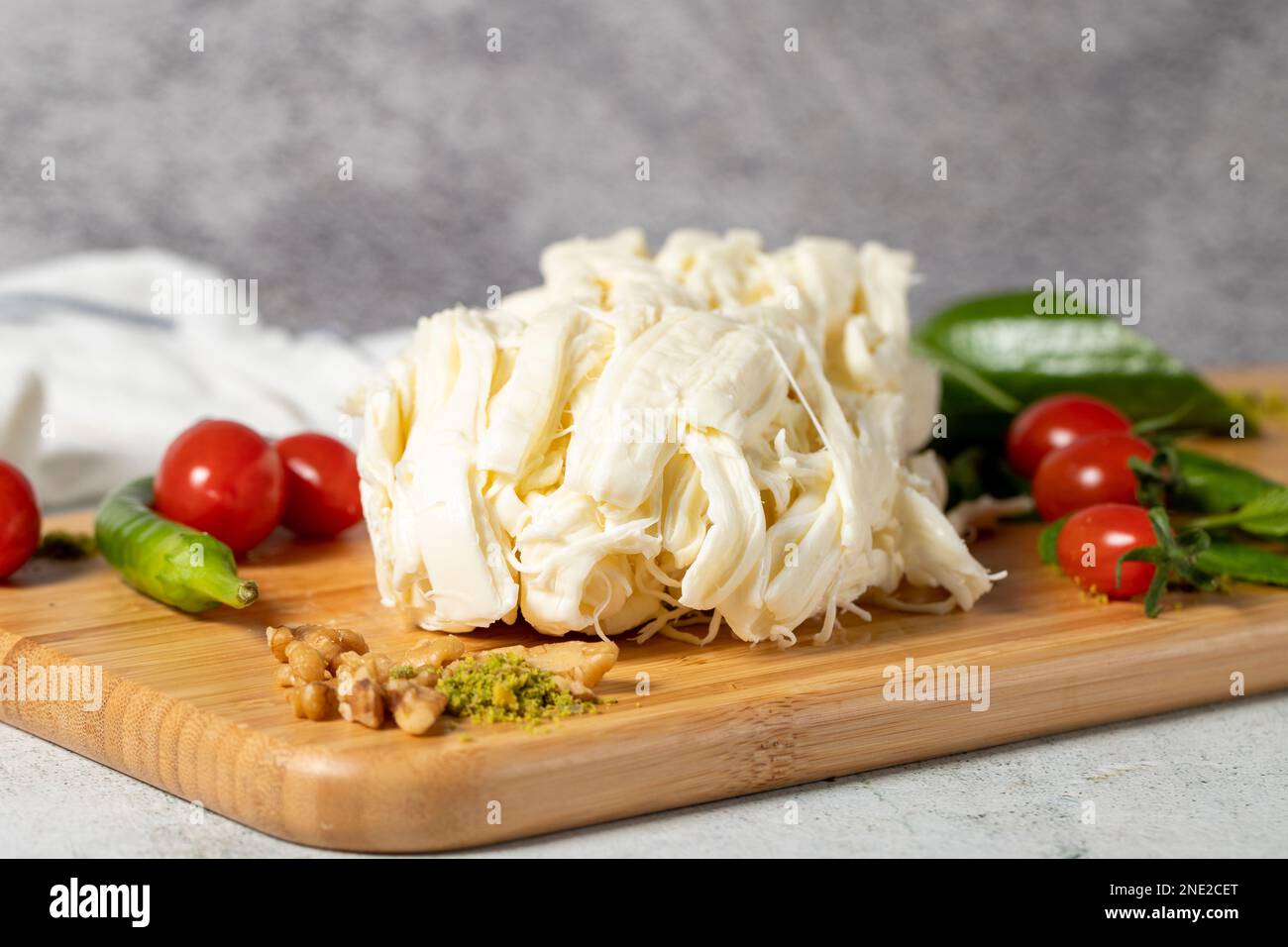 String cheese or Cecil cheese on a wood serving board. Dairy products ...