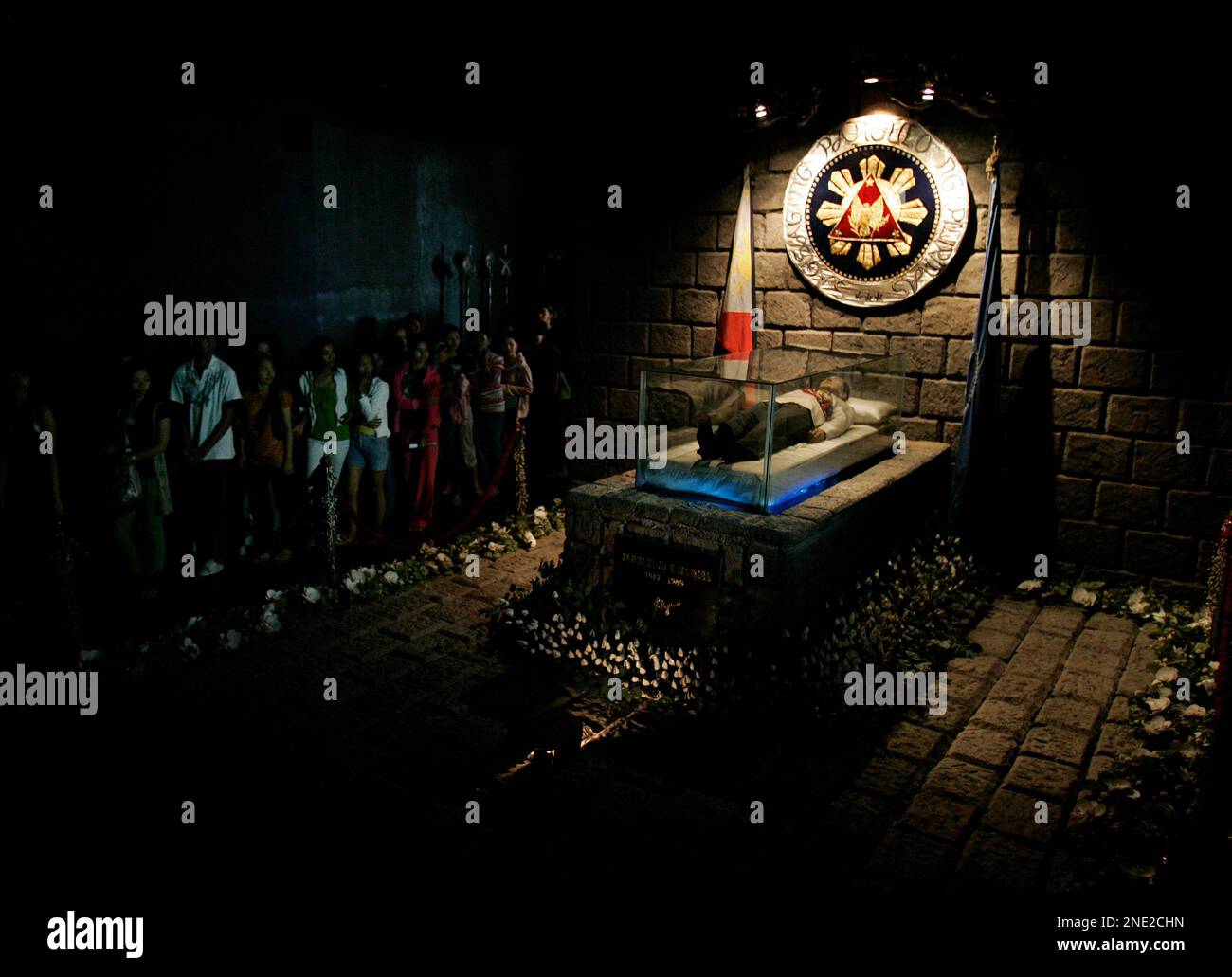 Visitors look inside the mausoleum where the glass coffin of the late ...