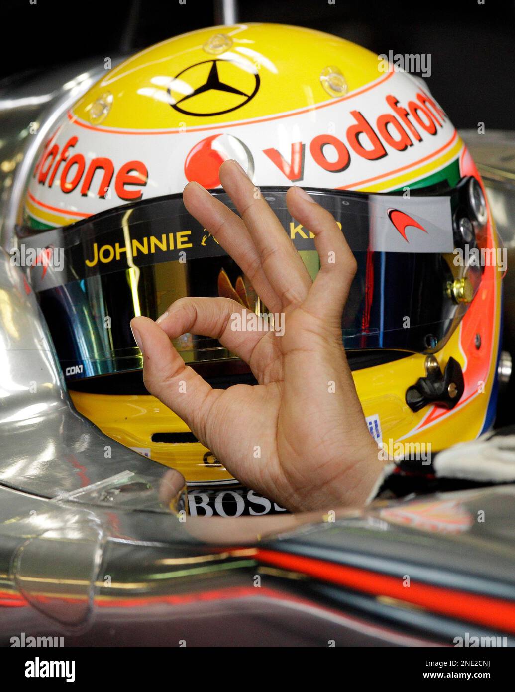 McLaren Formula One driver Lewis Hamilton of Britain gestures to his ...