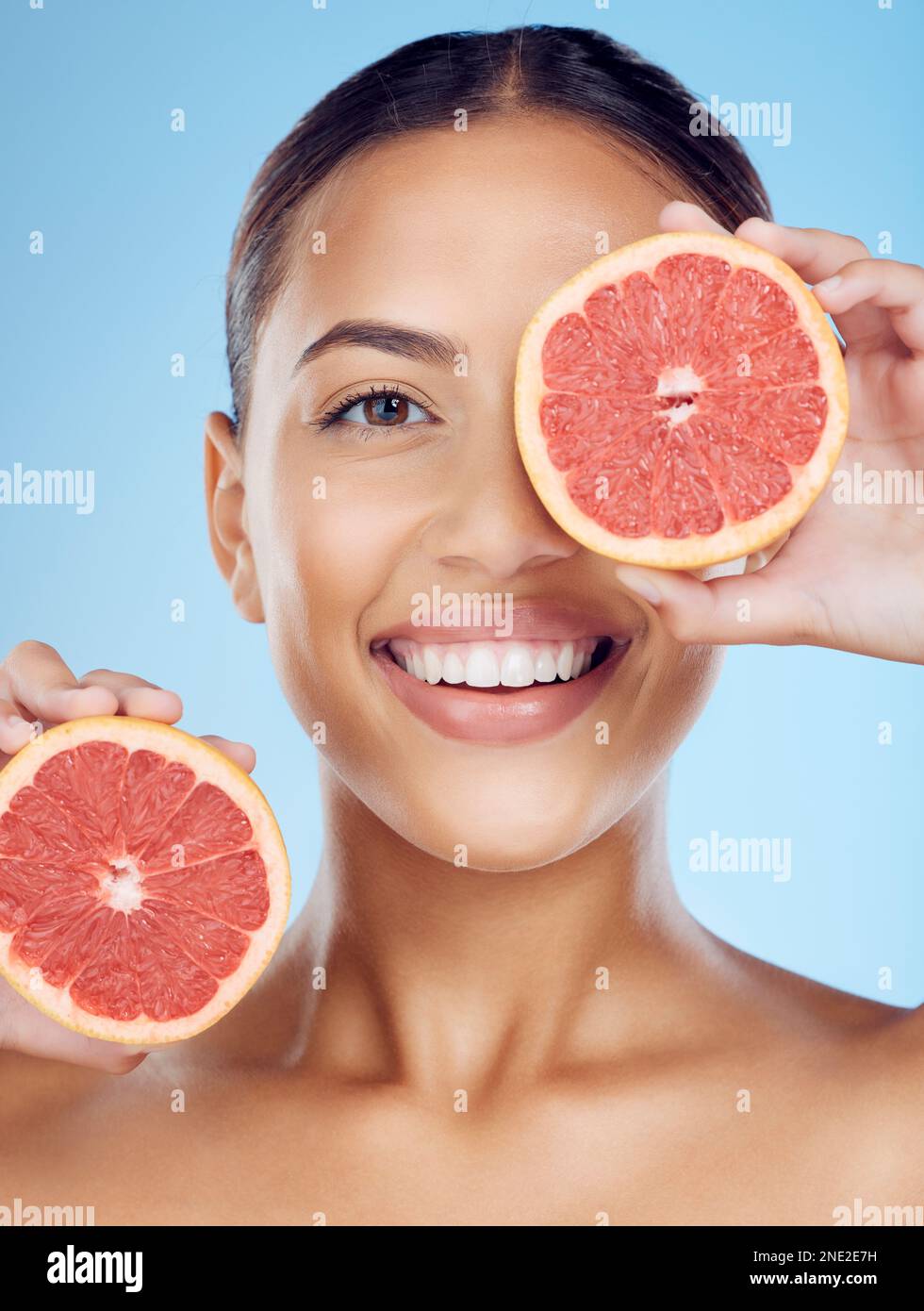 Grapefruit, portrait and woman cover eyes for beauty on studio ...